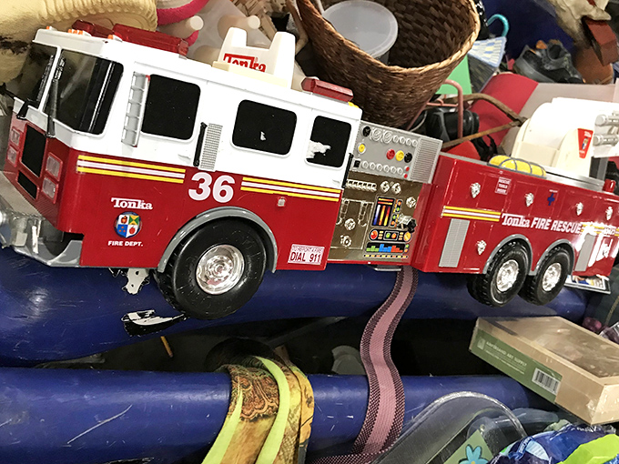 Heroes come in all sizes. This well-loved fire truck probably responded to countless imaginary emergencies before retiring to the blue bin brigade.