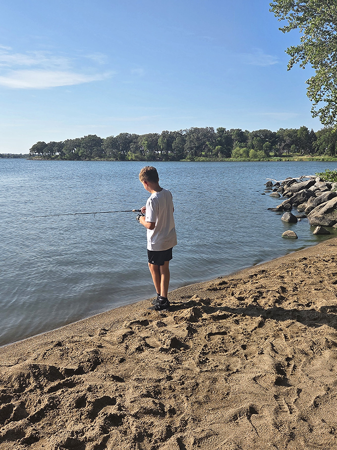 Patience in practice. This young angler demonstrates the timeless art of fishing – where catching something is just a bonus.