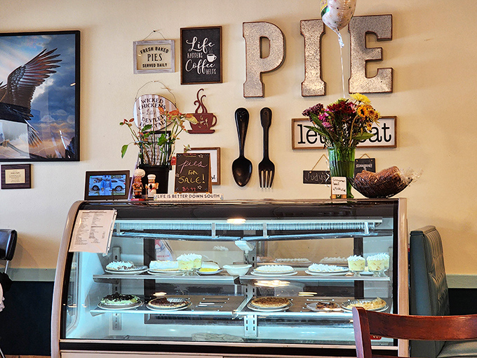 The wall display celebrates the holy trinity of diner religion: coffee, pie, and the commandment to "let's eat" &ndash; a shrine to simple pleasures.