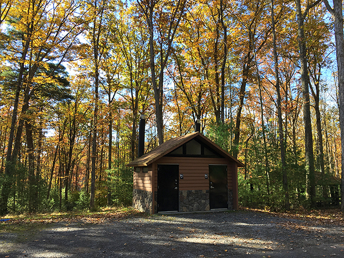 This rustic cabin surrounded by fall foliage is what "getting away from it all" looked like before Instagram made it a hashtag.