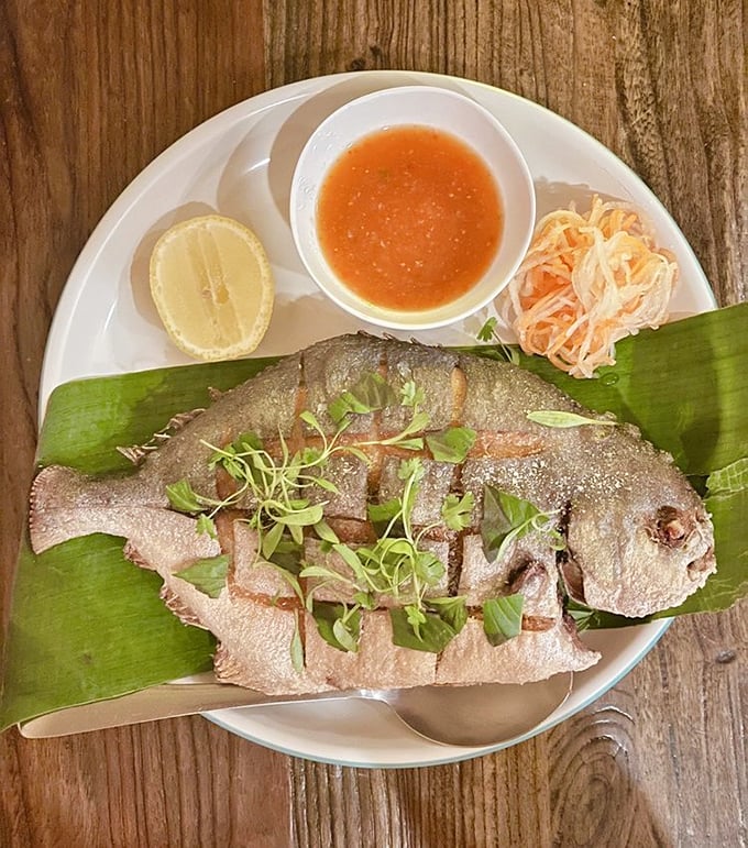 This isn't just fish&mdash;it's an aquatic masterpiece, delicately prepared and presented on banana leaves like the star it truly is.