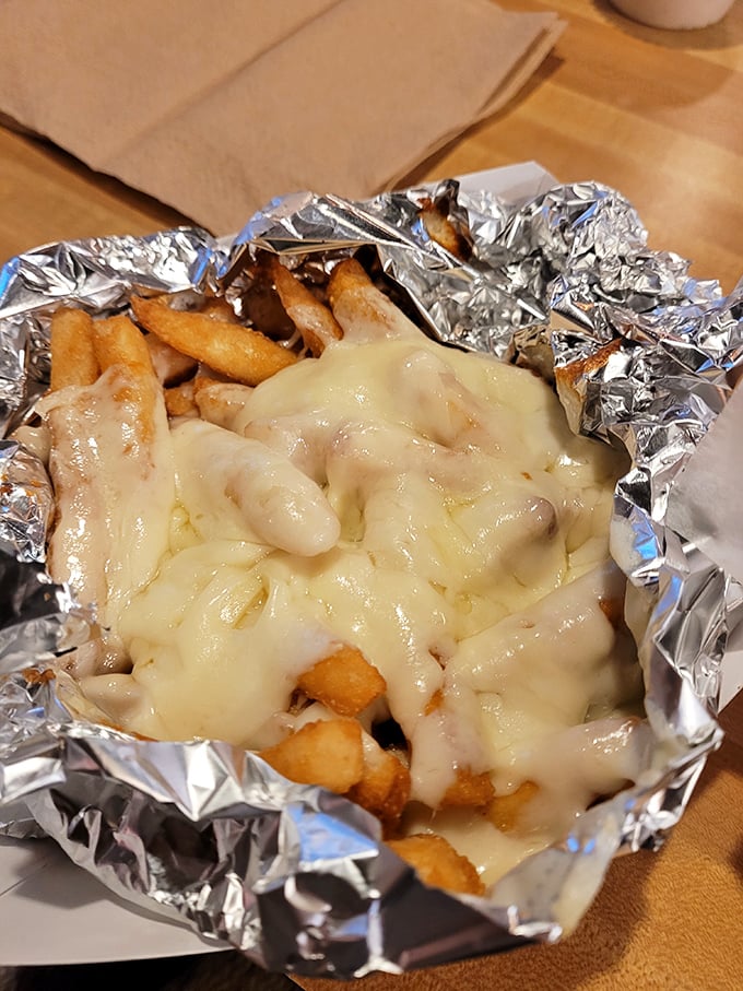 Loaded fries that blur the line between side dish and main event. That blanket of melted cheese is pure comfort in aluminum foil.