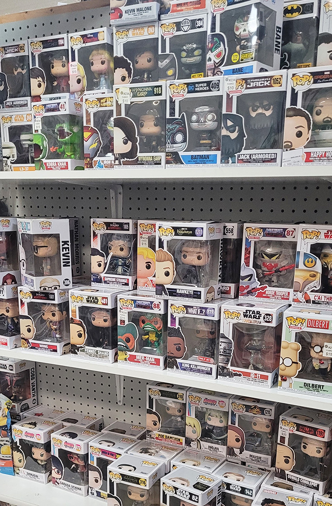 The Funko Pop army stands at attention, their boxed formations creating a wall of pop culture history. Batman to Star Wars, no fandom goes unrepresented here.