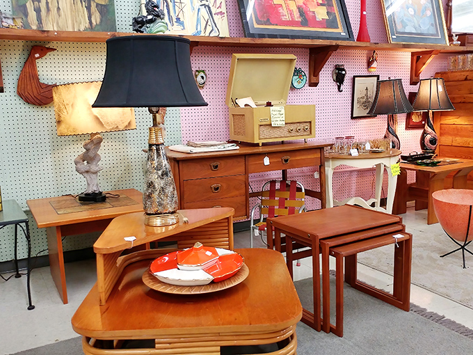 Mid-century furniture arranged like a 1960s living room waiting for Don Draper to pour himself a drink and settle in.