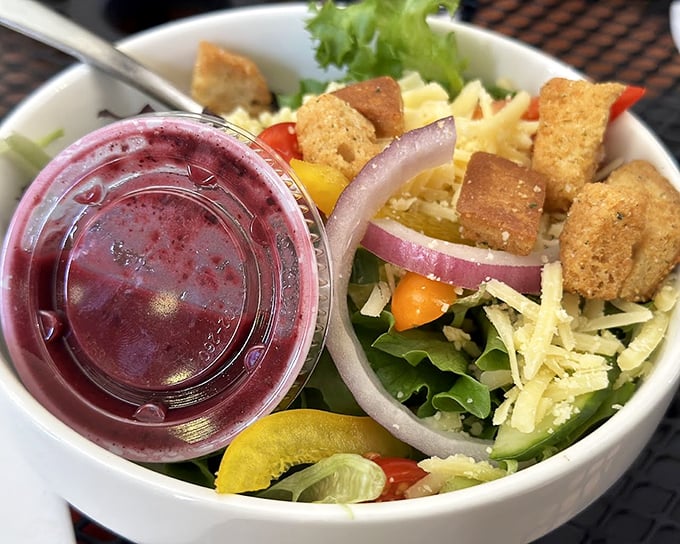 A rainbow in a bowl with that signature blackberry vinaigrette. Proof that salads don't have to be punishment between panini days.