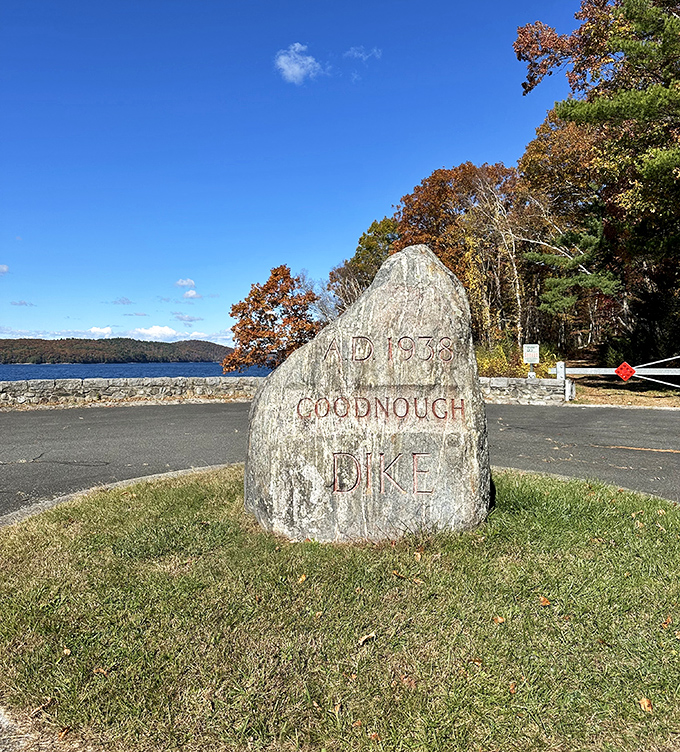 Goodnough Dike's historic marker stands sentinel by the reservoir, telling tales of villages sacrificed for Boston's thirst. History carved in stone.