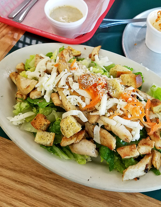 The calzone: pizza's sophisticated cousin that keeps all its delicious secrets tucked inside a golden, sesame-speckled crust until that first glorious bite.