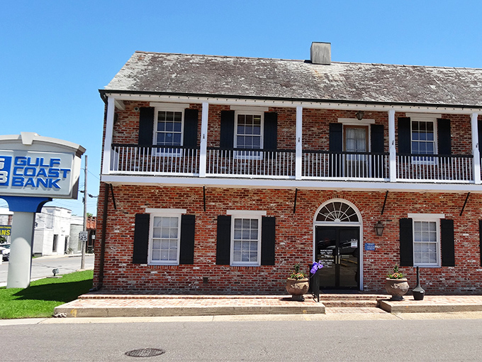Gulf Coast Bank's colonial-style building houses financial services with a personal touch—where your banker might ask about your garden before your account.