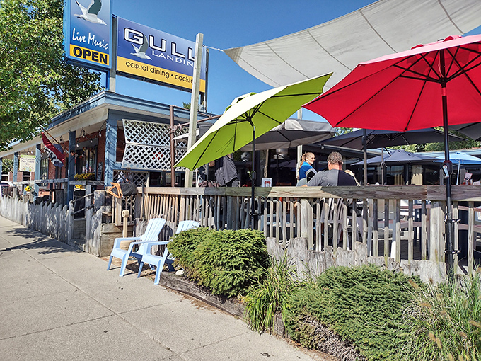 Gull Landing's colorful umbrellas promise what every vacation needs &ndash; shade, drinks, and the permission to do absolutely nothing productive.