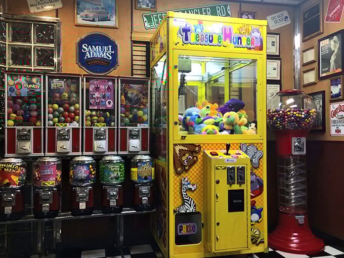 The arcade corner: where kids beg for quarters and adults secretly wish they could join in without judgment.