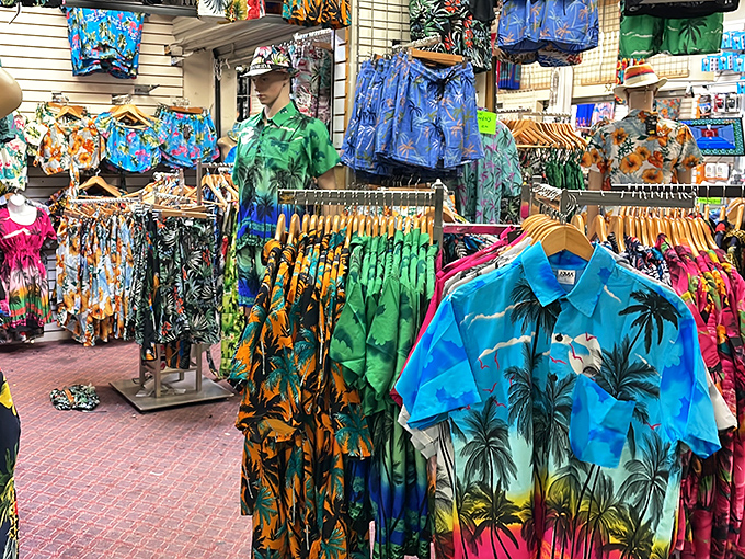 Hawaiian shirts in every imaginable color scheme stand ready to transform ordinary tourists into walking tropical postcards.