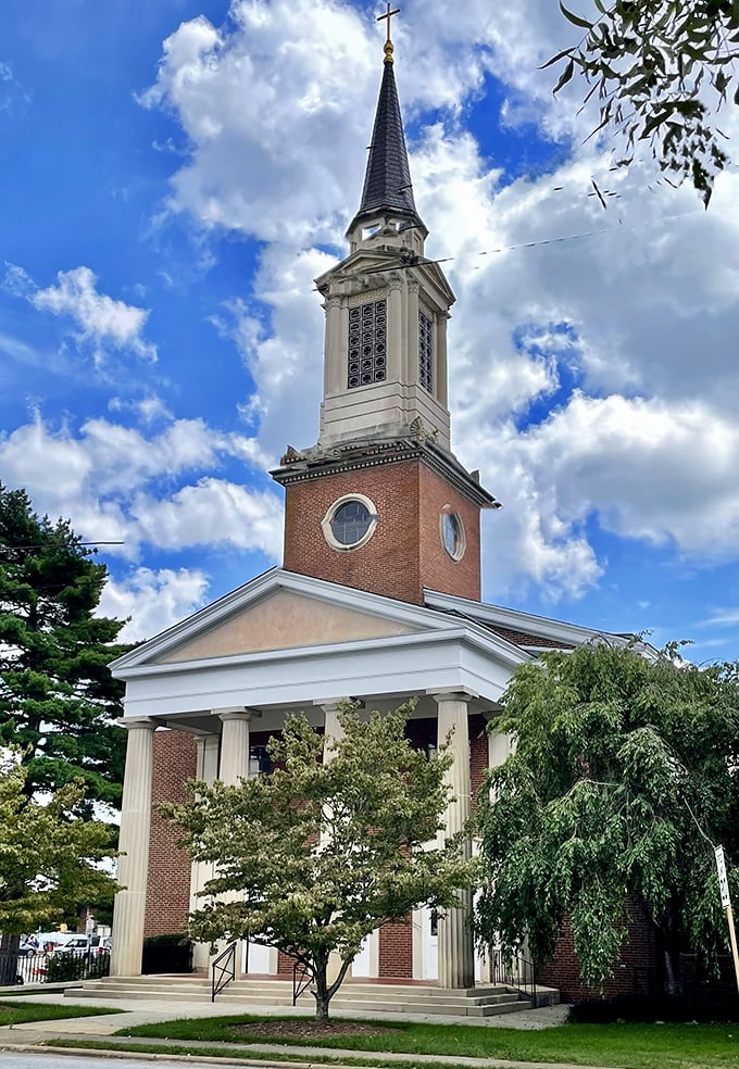 Hendersonville Presbyterian Church reaches skyward with its elegant steeple, a spiritual landmark that's been witnessing life's celebrations and sorrows for generations.