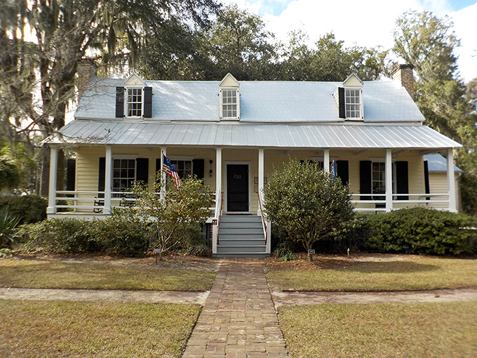 The Heyward House welcomes visitors with classic Lowcountry charm and historical significance. That porch practically begs you to sit a spell with a glass of sweet tea.