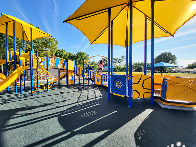 Hickory Park's playground equipment gleams in the Arkansas sunshine, offering kids the increasingly rare opportunity to play without staring at screens.