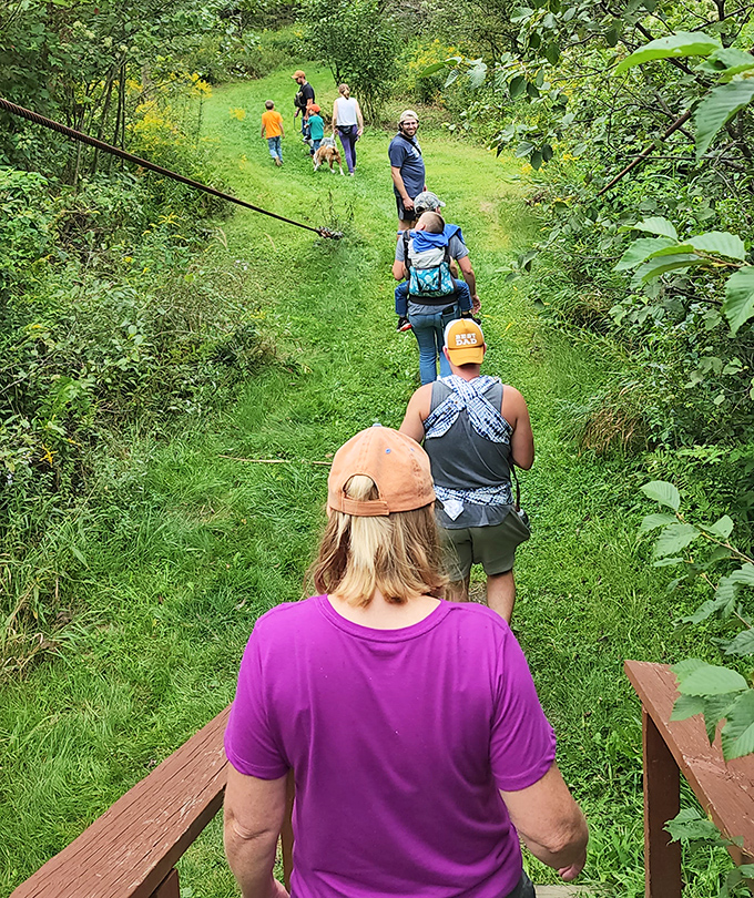 Hikers follow nature's green carpet through Chapman's lush trails. The unspoken rule: whoever wears the brightest shirt automatically becomes the group leader.