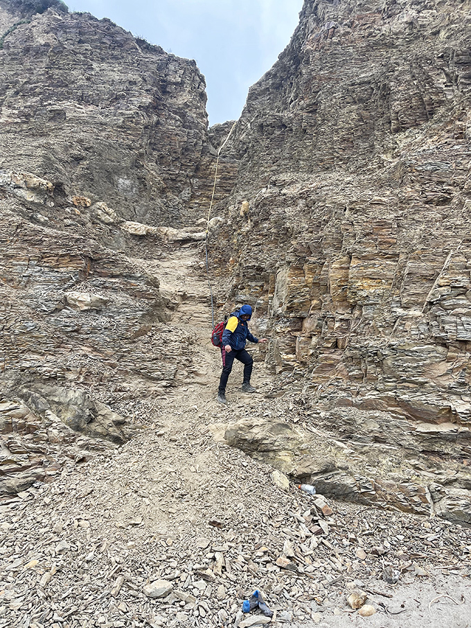 The narrow path through towering cliffs demands respect and proper footwear&mdash;flip-flops need not apply for this adventure.