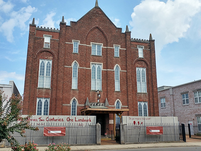 The Hiram Masonic Lodge stands like a Victorian sentinel, its brick fa&ccedil;ade and gothic windows hinting at centuries of brotherhood and community service.