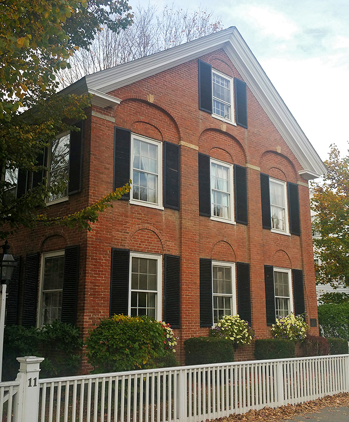 Classic New England architecture with window boxes that could make Martha Stewart drop her gardening shears in admiration.