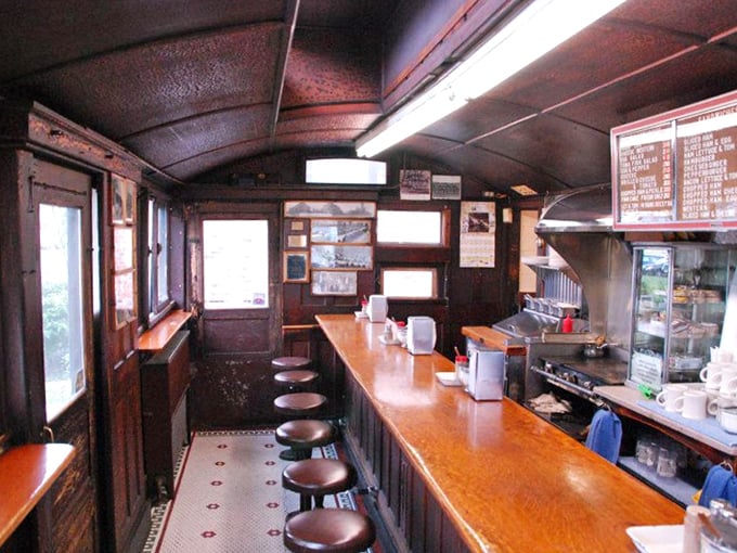 The interior view reveals the artful dance of efficiency &ndash; every inch of space serving a purpose in this perfectly preserved diner car.