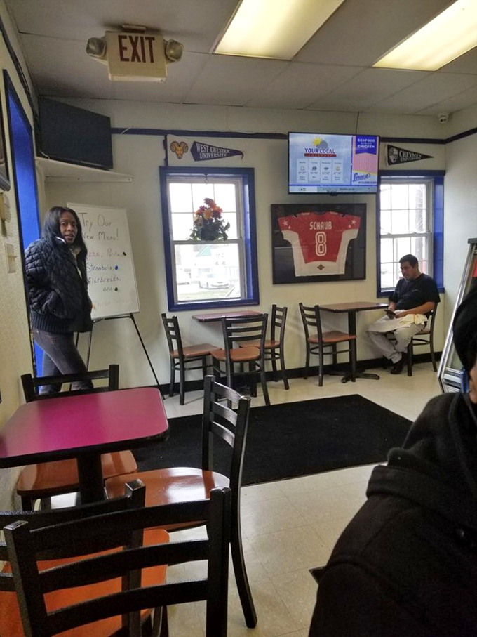 College pennants and sports memorabilia create that classic sandwich shop atmosphere where great food memories are made.