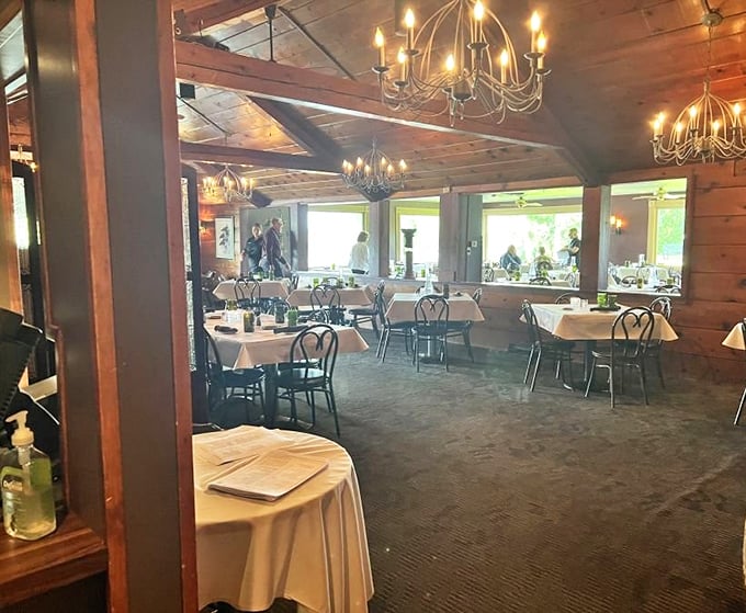 Wood-paneled warmth and elegant chandeliers create the perfect backdrop for conversations that linger longer than dessert.