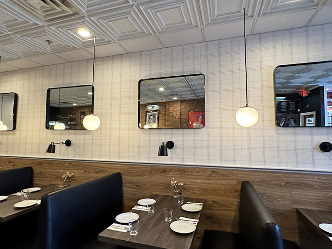 The dining room's thoughtful design creates an intimate experience where conversations flow as easily as the wine you brought yourself.