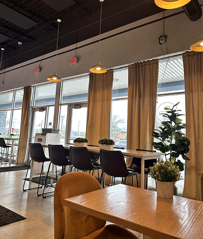 Tall windows flood the space with natural light, creating the perfect backdrop for both serious conversations and lighthearted brunch debates.