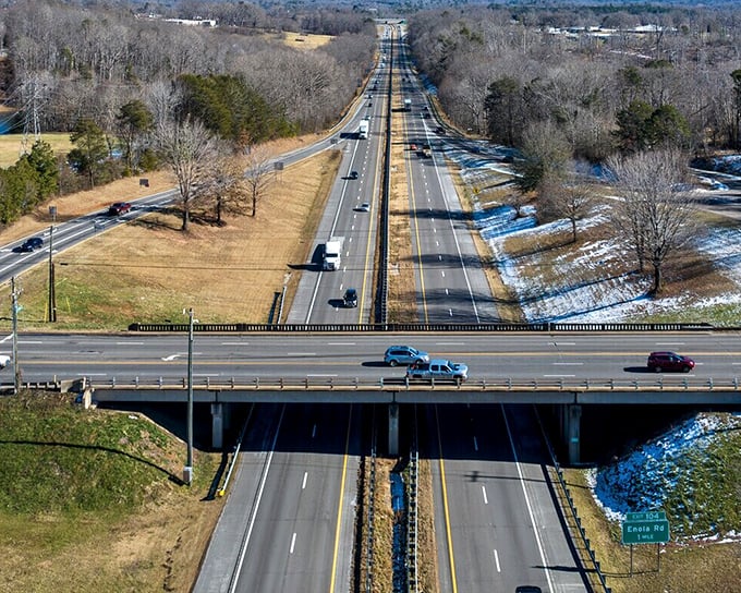Interstate 40 cuts through the rolling landscape, a modern artery connecting Morganton to the wider world beyond the mountains.
