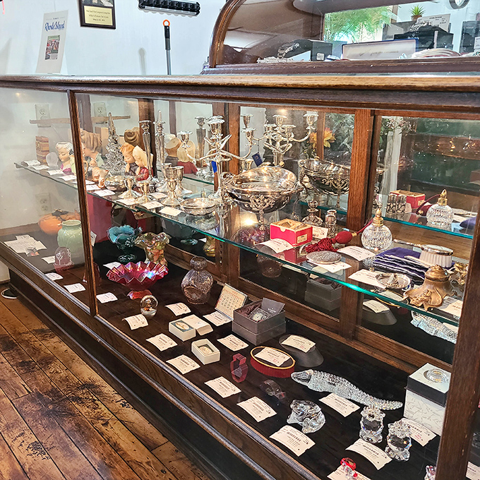 This isn't just a display case&mdash;it's a time capsule of elegance where silver candelabras and crystal decanters await their second act.