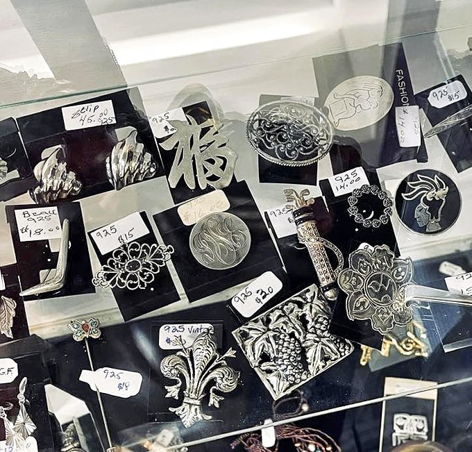 Tiny treasures in the jewelry case&mdash;vintage brooches and silver pieces waiting to become conversation starters at your next gathering. 