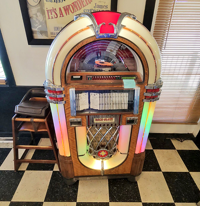 The crown jewel of nostalgia&mdash;a vintage jukebox glowing with rainbow lights. Drop in a quarter and let Elvis serenade your meal.