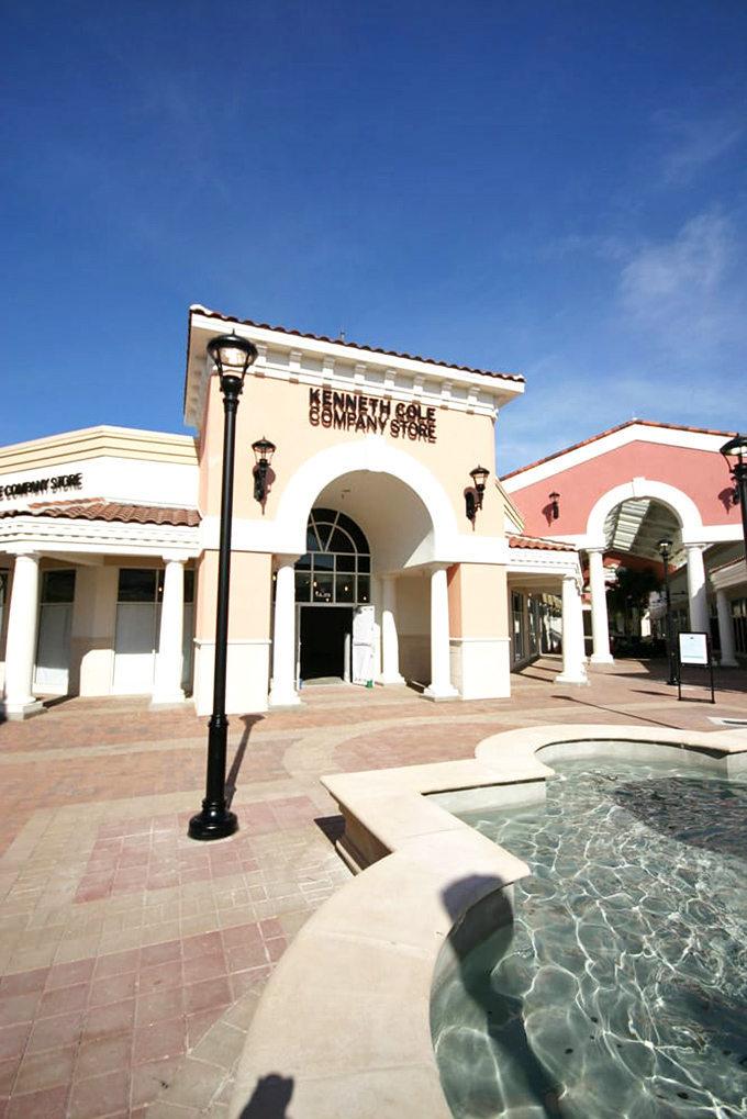 Kenneth Cole's storefront features a refreshing fountain&mdash;symbolizing how your spending anxiety melts away when everything's 40% off retail.