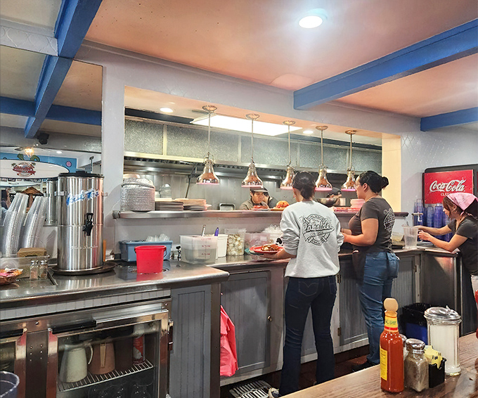 The staff moves with practiced efficiency, like breakfast ballet performers who've mastered their craft.