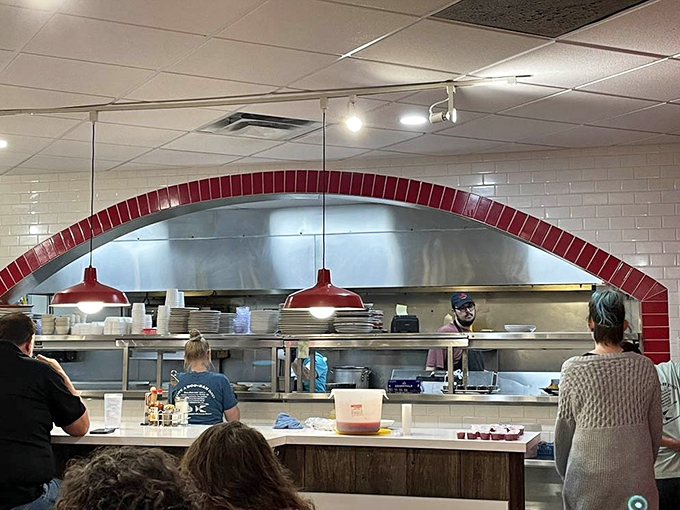 The bustling kitchen counter shows vintage advertising and organized chaos, where breakfast dreams become reality on every plate ordered.