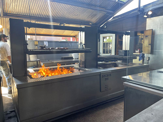 The heart of the operation: Jocko's legendary oak pit in all its fiery glory. This isn't cooking; it's a time-honored ritual performed by flame-wielding wizards.