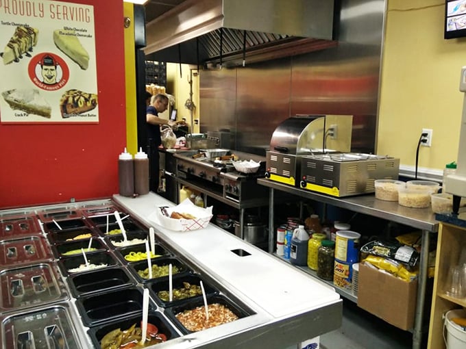 The open kitchen reveals the hot dog assembly line where ordinary franks undergo their transformation into extraordinary creations worth writing home about.