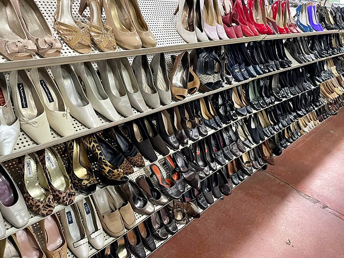 If Imelda Marcos had shopped thrift, her collection might look like this impressive wall of ladies' footwear in every imaginable style and color.