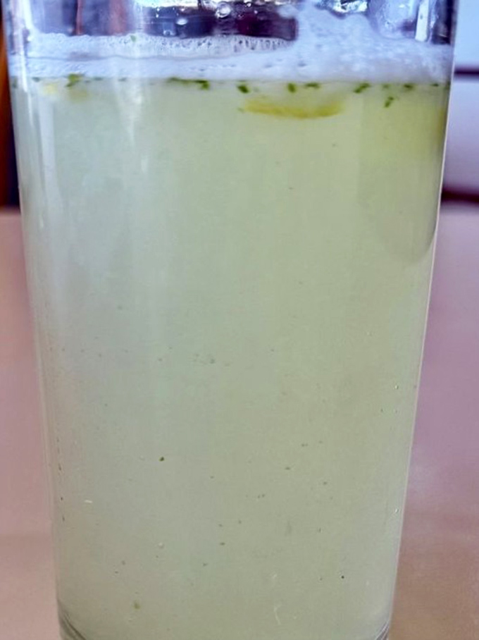 This isn't just lemonade; it's liquid sunshine with mint leaves doing the backstroke. The perfect palate cleanser between bites of savory bliss.