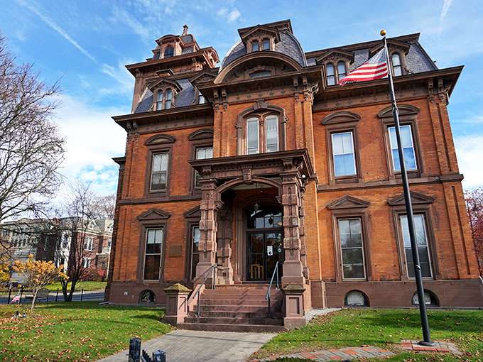 The North Adams Public Library stands as Victorian grandeur personified, housing stories within its brick walls while telling one of its own.