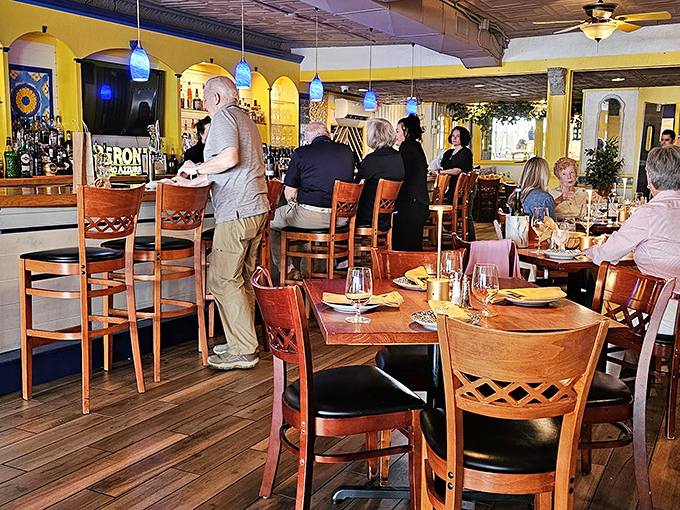 Where warm wood meets golden walls&mdash;Limoncello's inviting interior promises Italian flavors with Maryland hospitality in every bite.