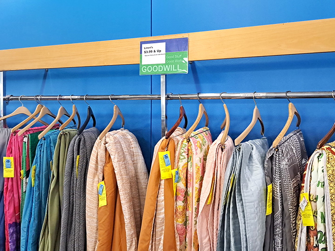 Color-coded clothing with yellow tags announcing special deals. Like a rainbow of fashion possibilities, each hanger holds potential for your wardrobe revolution.