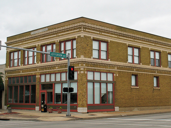 The Lingsweiler Building's yellow brick and red-trimmed windows create a downtown cornerstone where history and commerce continue their long conversation.