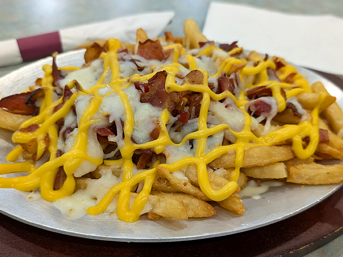 Loaded fries that answer the eternal question: "Can french fries get any better?" with a resounding "Yes, add cheese and bacon!"