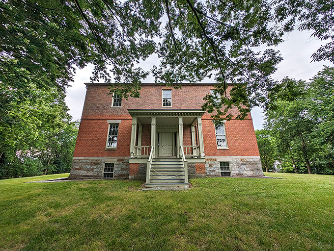 This stately brick building stands with the quiet dignity of someone who's seen it all and has stories that would keep you up all night.