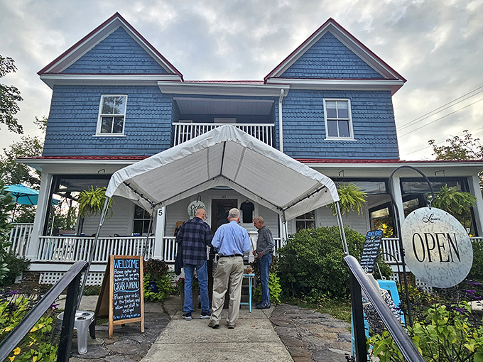 Blue as the Carolina sky, this Victorian charmer welcomes you with wraparound porches and small-town hospitality.