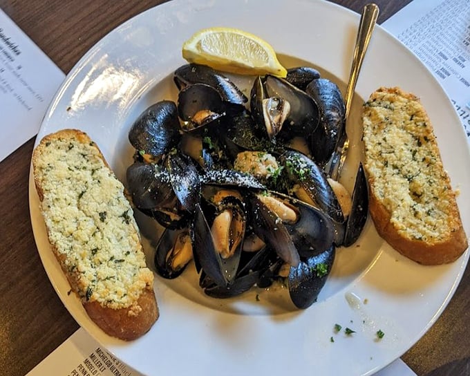 These mussels have opened up about their feelings, and they're saying "eat me now." Garlic bread stands by, ready for sauce-sopping duty.