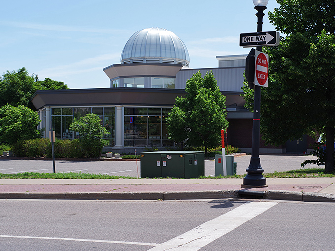 The Marquette Regional History Center's dome gleams like a silver beacon of knowledge—or an elaborate hat for a building with excellent taste.