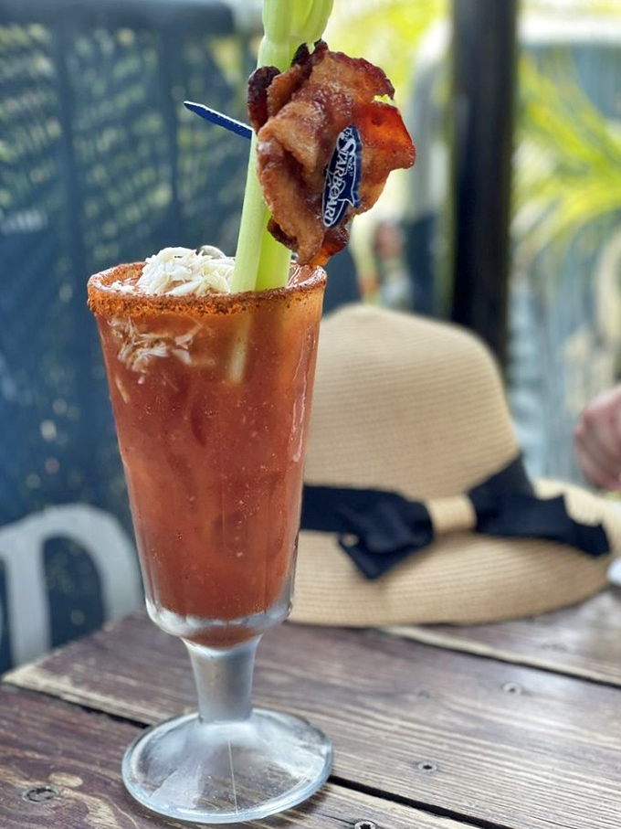 A Bloody Mary garnished with enough food to qualify as a salad bar, because why drink your vegetables when you can eat them?
