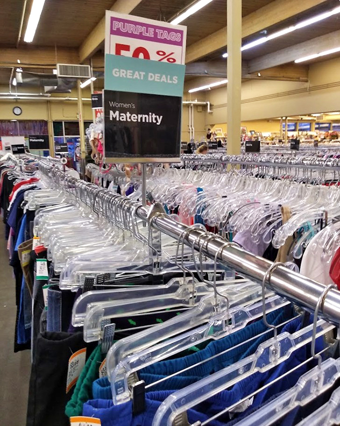 Purple tags announce 50% off maternity clothes&mdash;because growing a human shouldn't require growing your credit card debt too.