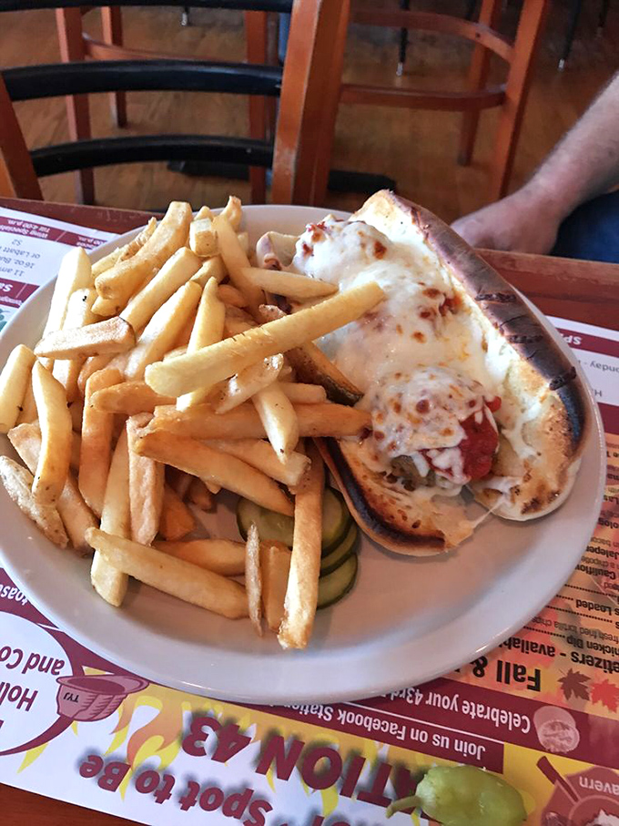 The meatball sub arrives like a comfort food superhero, ready to rescue you from hunger with its cheese cape and marinara powers.